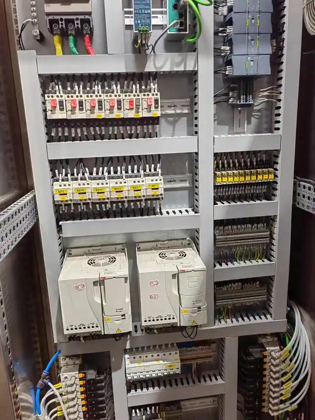 What is the reason for installing a signal isolator in the PLC